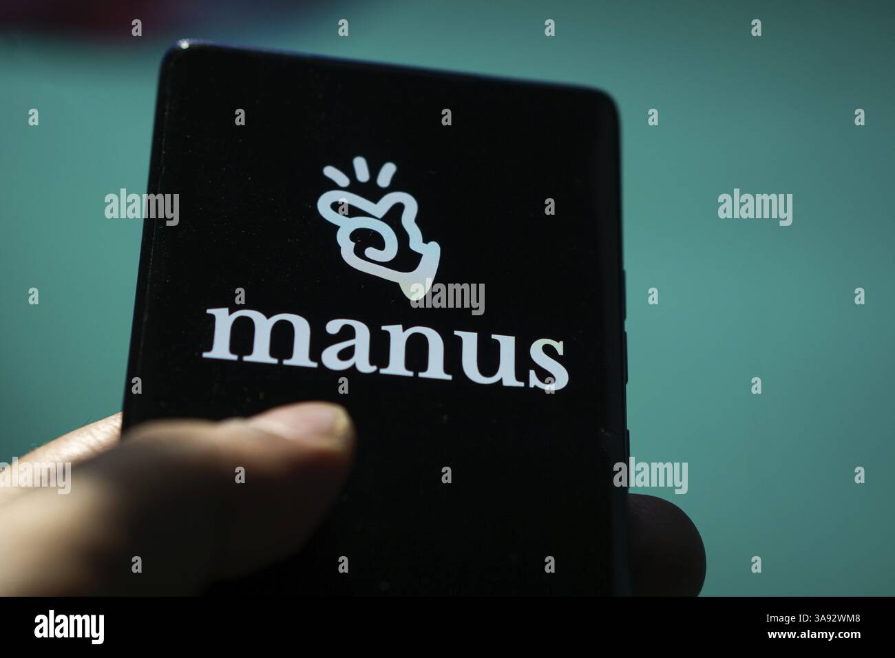 Close up of Manus logo on screen of mobile phone Stock Photo - Alamy