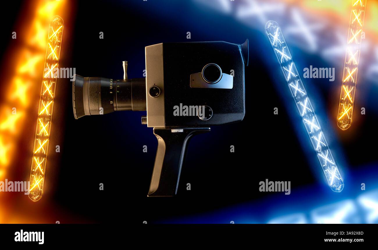 Old analog camera surrounded by LED bulbs in warm yellow and cold blue ...