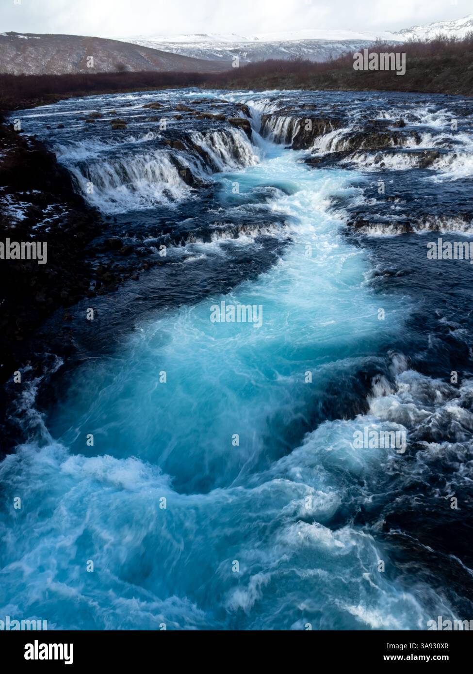 Bruarafoss Waterfall, Iceland: Crystal-clear turquoise water cascading ...
