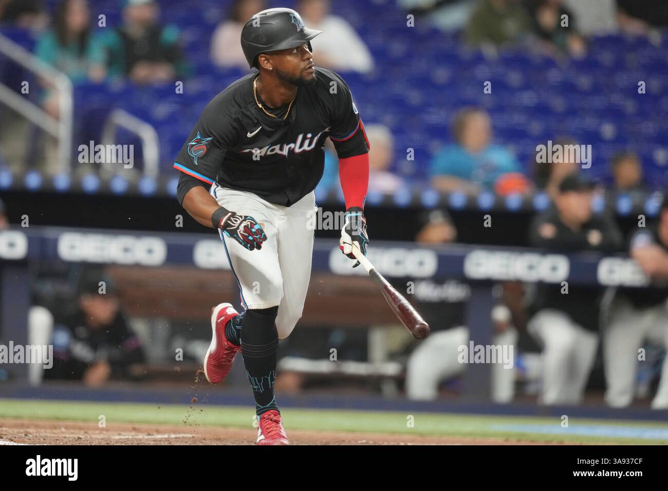 Miami Marlins' Otto Lopez runs after hitting a single during the first ...