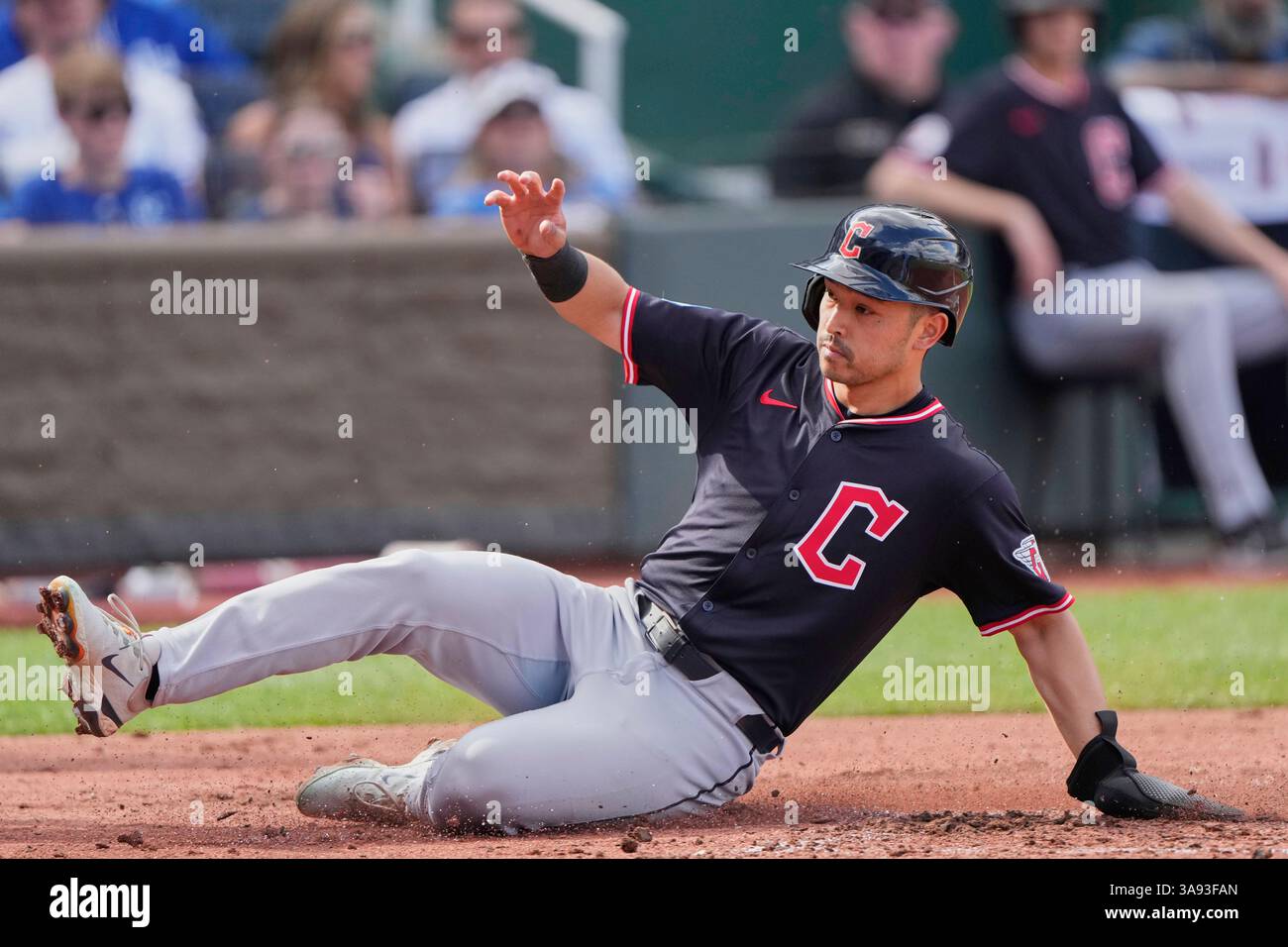 Cleveland Guardians' Steven Kwan slides home to score on a sacrifice ...