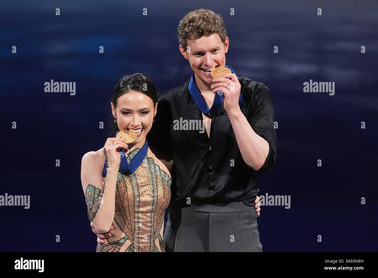 Gold medalists Madison Chock and Evan Bates, of the United States, pose ...