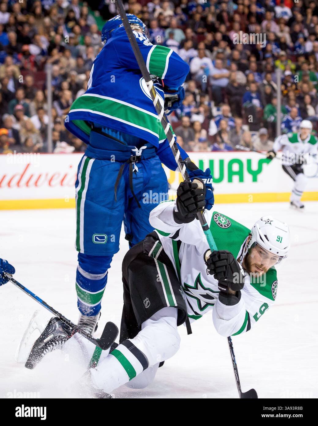 October 30, 2017: Canucks center Brandon Sutter (20) jumps to grab the ...