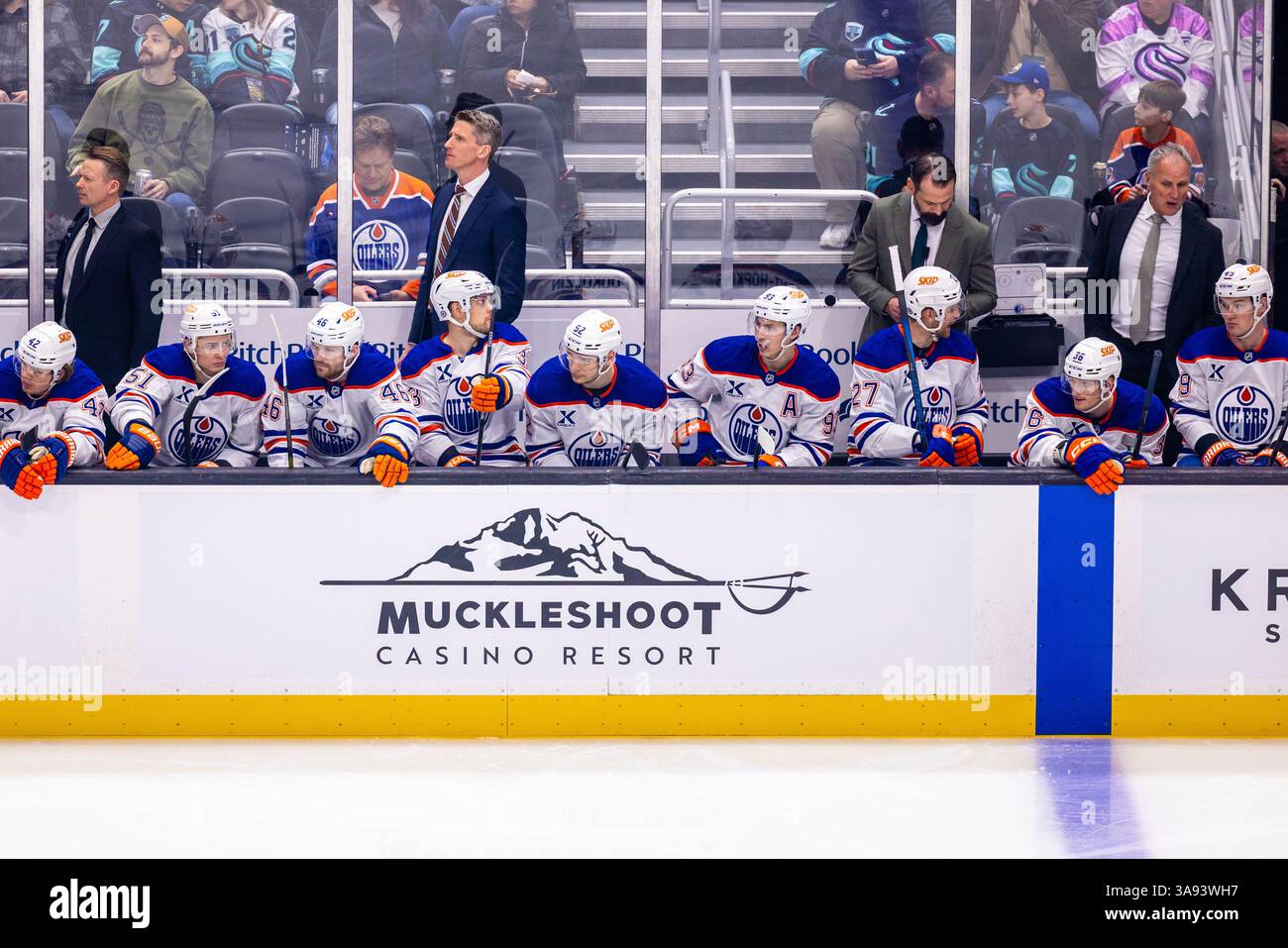 Edmonton Oilers players sit on the bench during an NHL hockey game ...