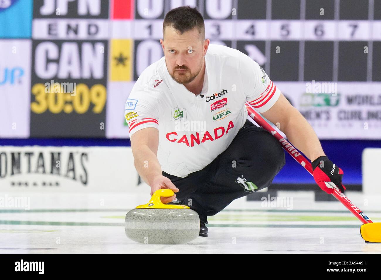 Canada's Lead Ben Herbert throws a stone at the World Men's Curling ...
