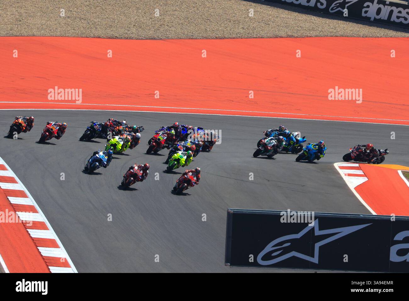 AUSTIN, TX - MARCH 29: Racers speed through the first turn during the ...