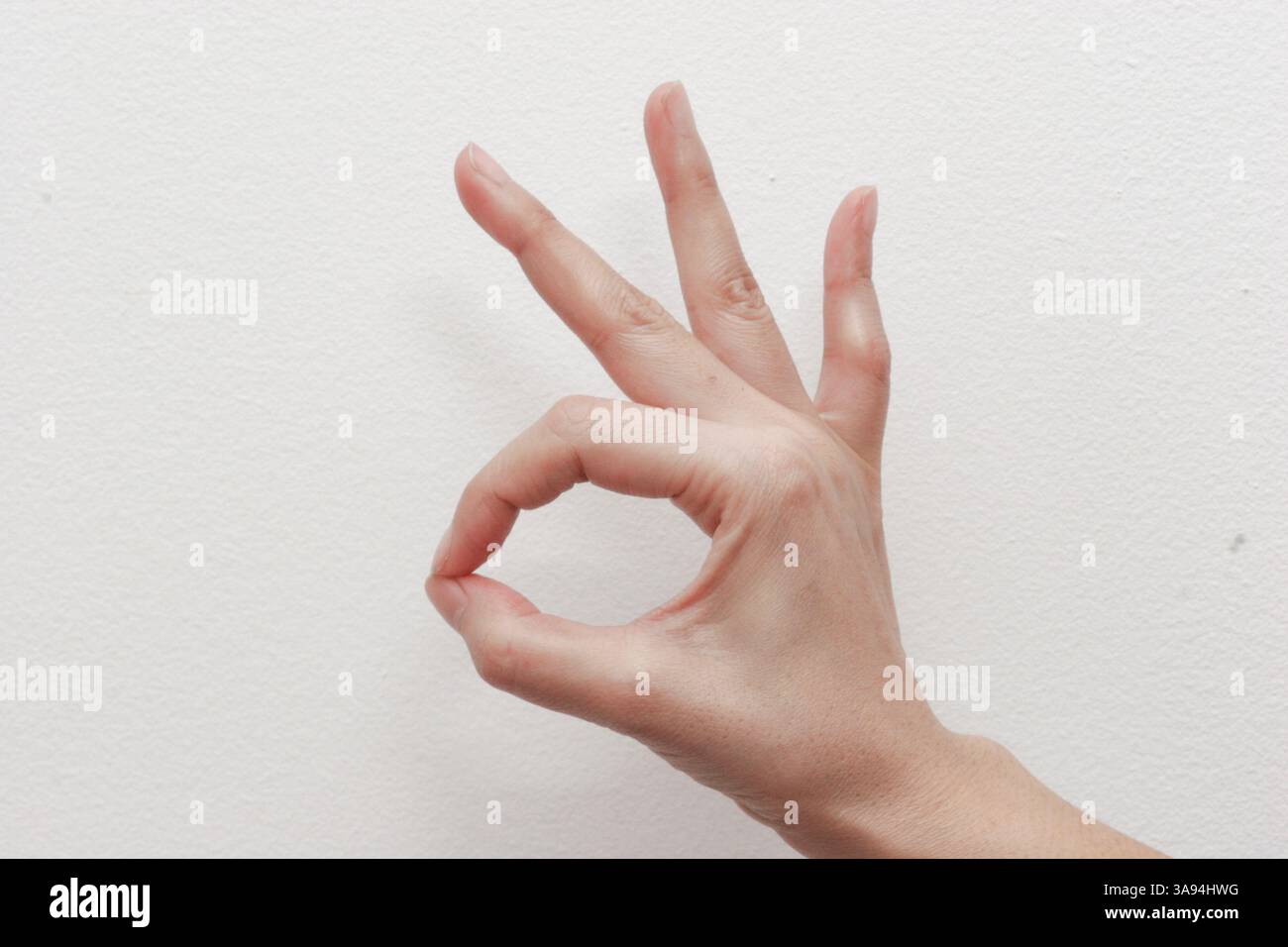 Asian female making hand gestures hi-res stock photography and images ...