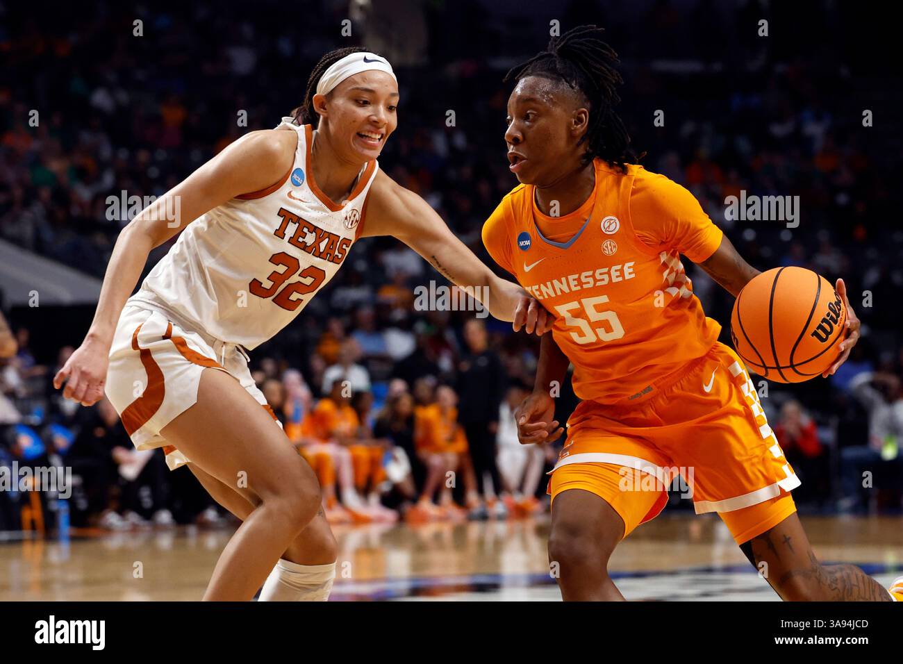 Tennessee guard Talaysia Cooper (55) dribbles around Texas guard ...