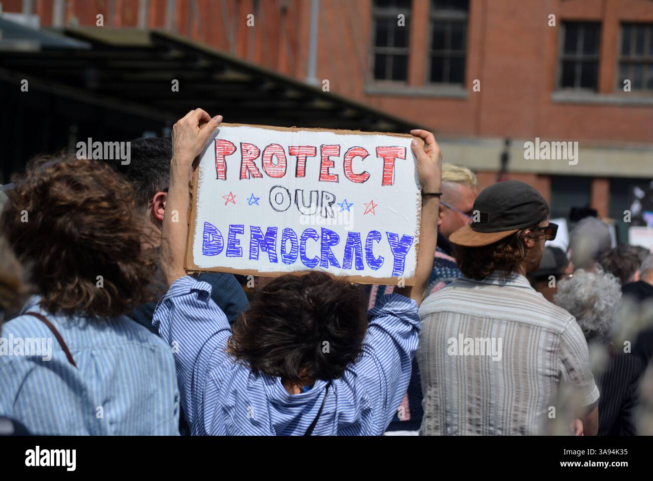 Tesla Takedown event against DOGE and Elon Musk marching to a Tesla ...
