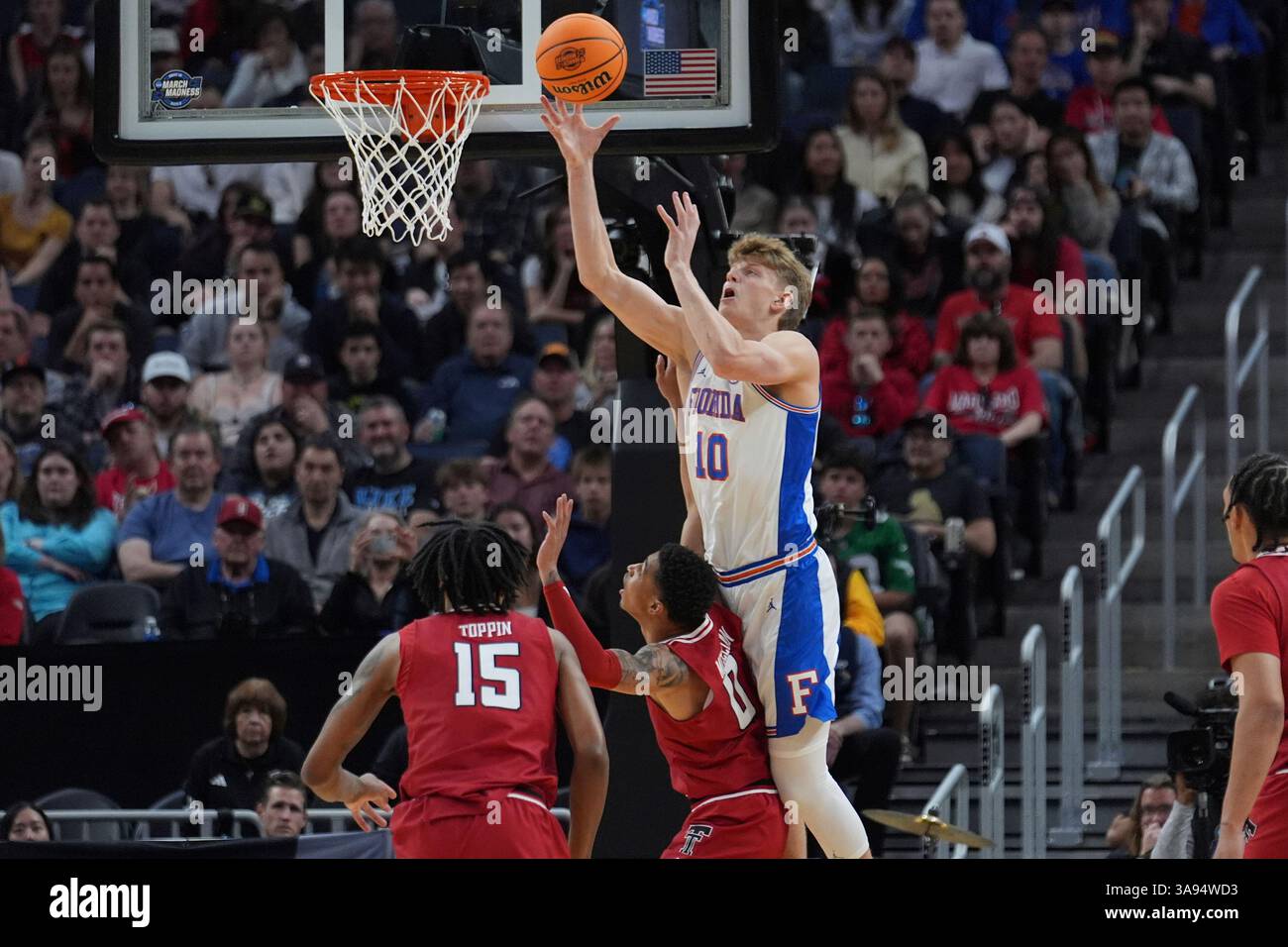 Florida forward Thomas Haugh (10) rebounds over Texas Tech guard Chance ...