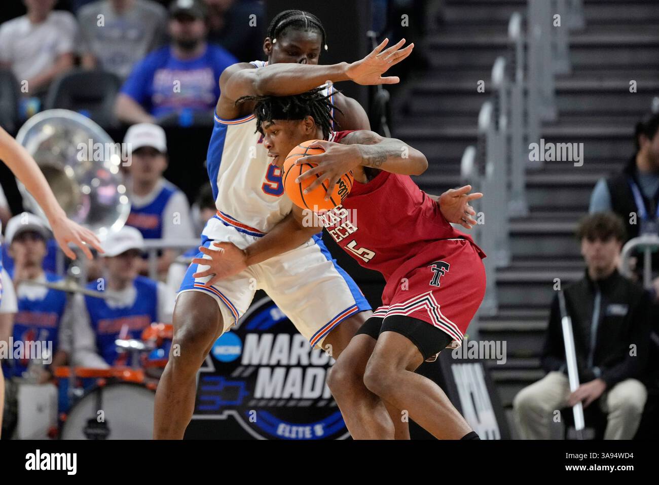 Texas Tech forward JT Toppin drives on Florida center Rueben Chinyelu (9) during the first half ...