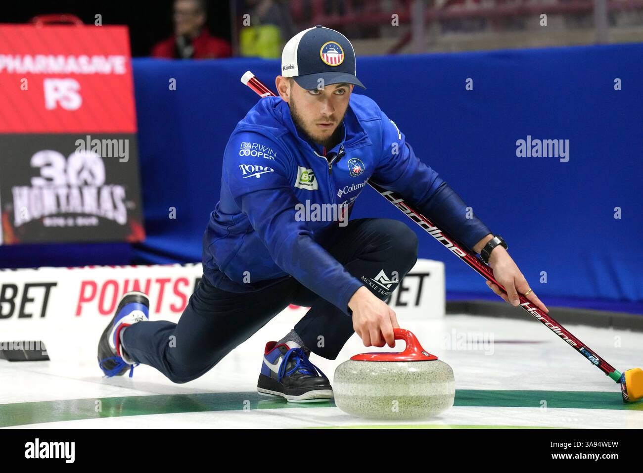 United States' skip Korey Dropkin slides a stone during his team's win ...