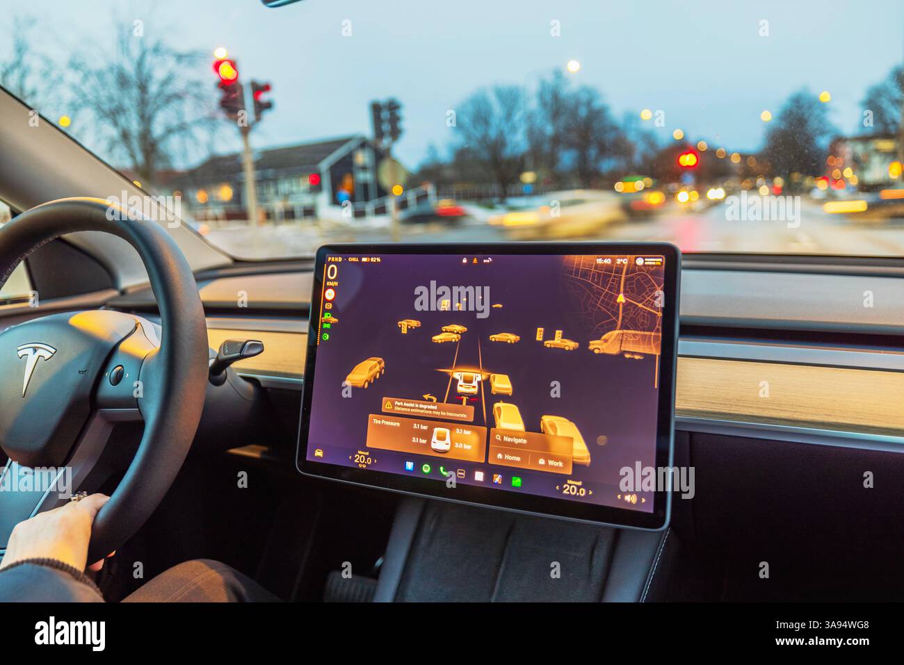 Interior of electric Tesla Model Y SUV with autopilot display while ...