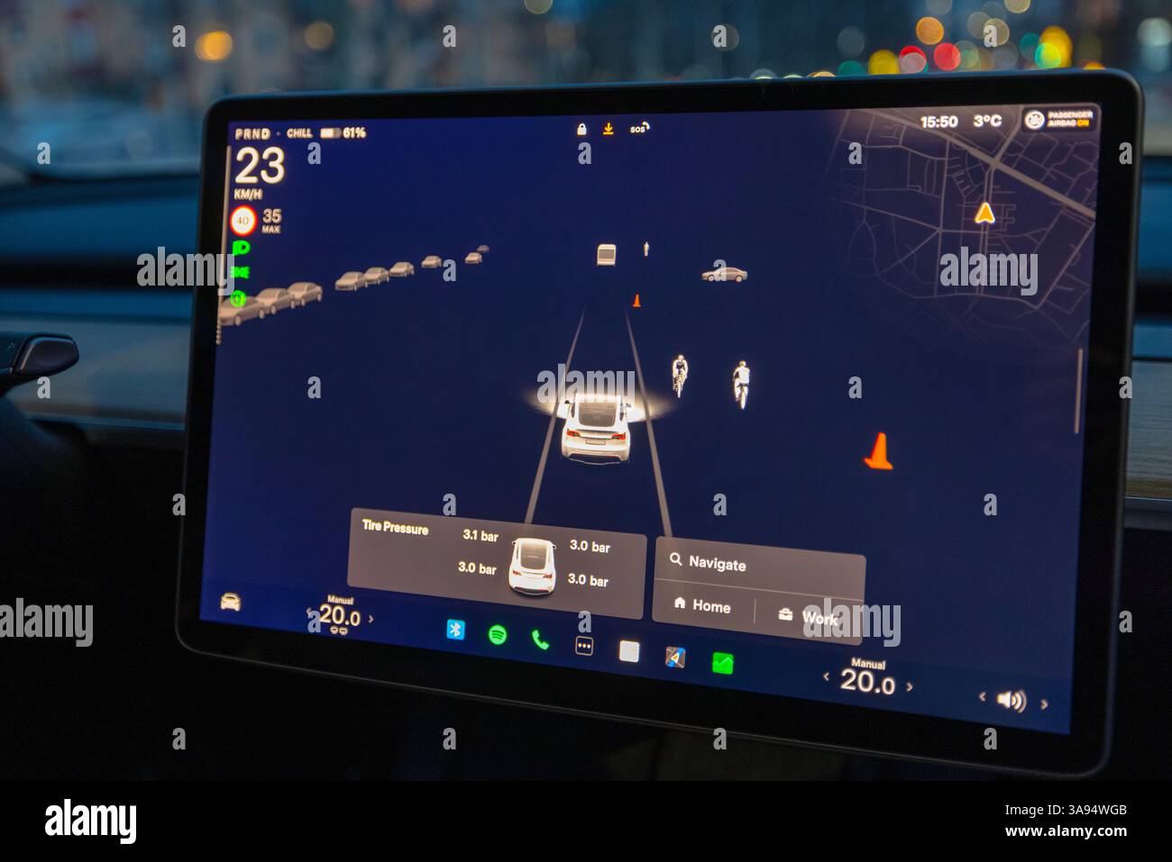 Tesla Model Y autopilot screen shows road with cyclists, traffic cones ...