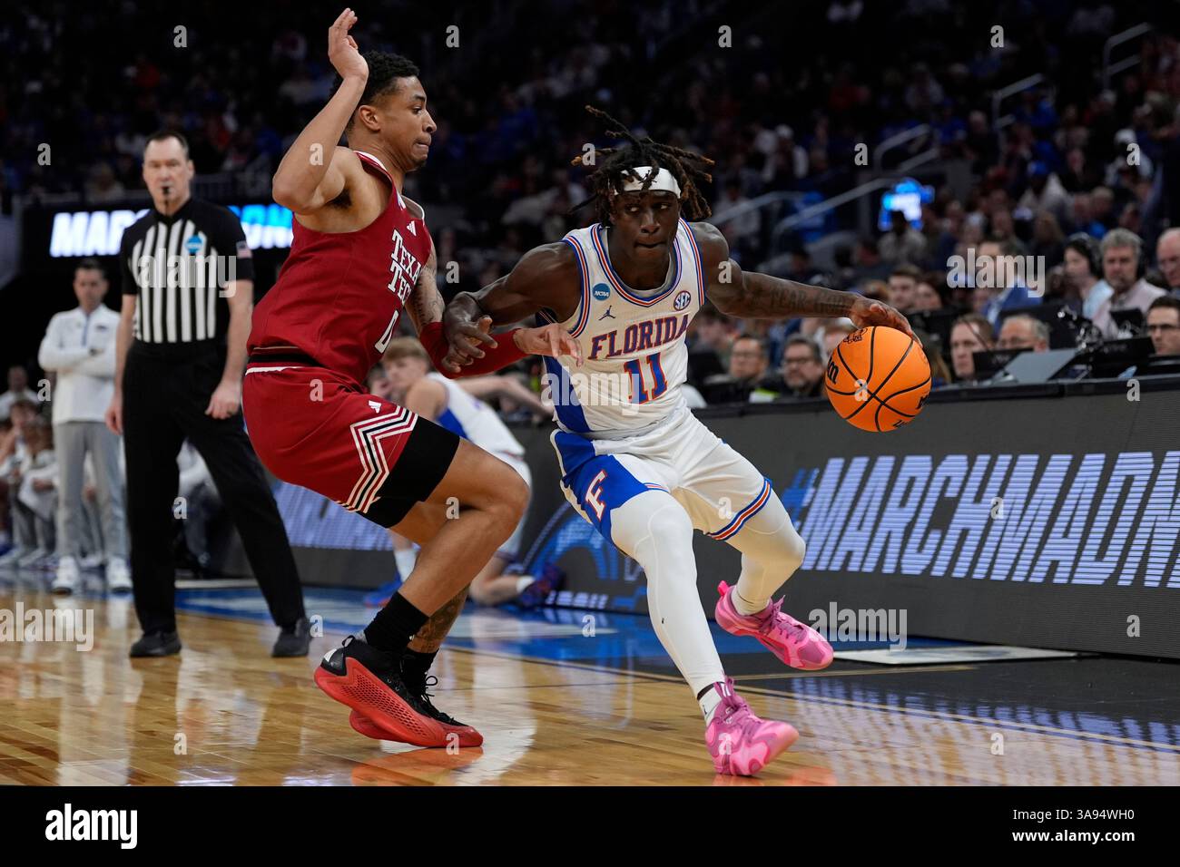 Florida guard Denzel Aberdeen (11) drives on Texas Tech guard Chance ...