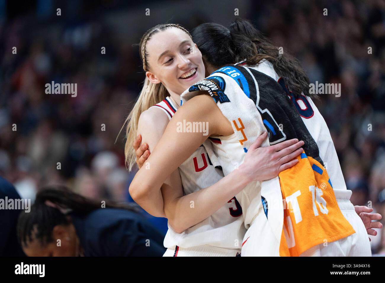 UConn guard Paige Bueckers, left, hugs center Jana El Alfy during the second half in the Sweet ...