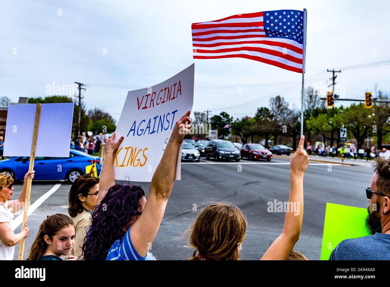 Richmond, Virginia, USA. 29th Mar, 2025. Protesters hold signs and ...