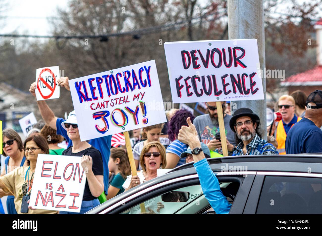 Richmond, Virginia, USA. 29th Mar, 2025. A passerby gives a thumbs-up ...