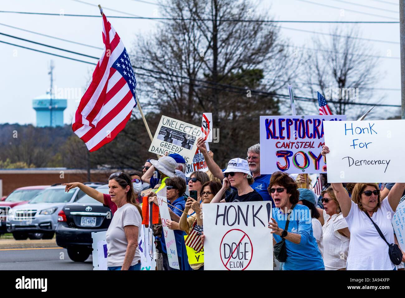 Richmond, Virginia, USA. 29th Mar, 2025. Protesters hold signs and ...