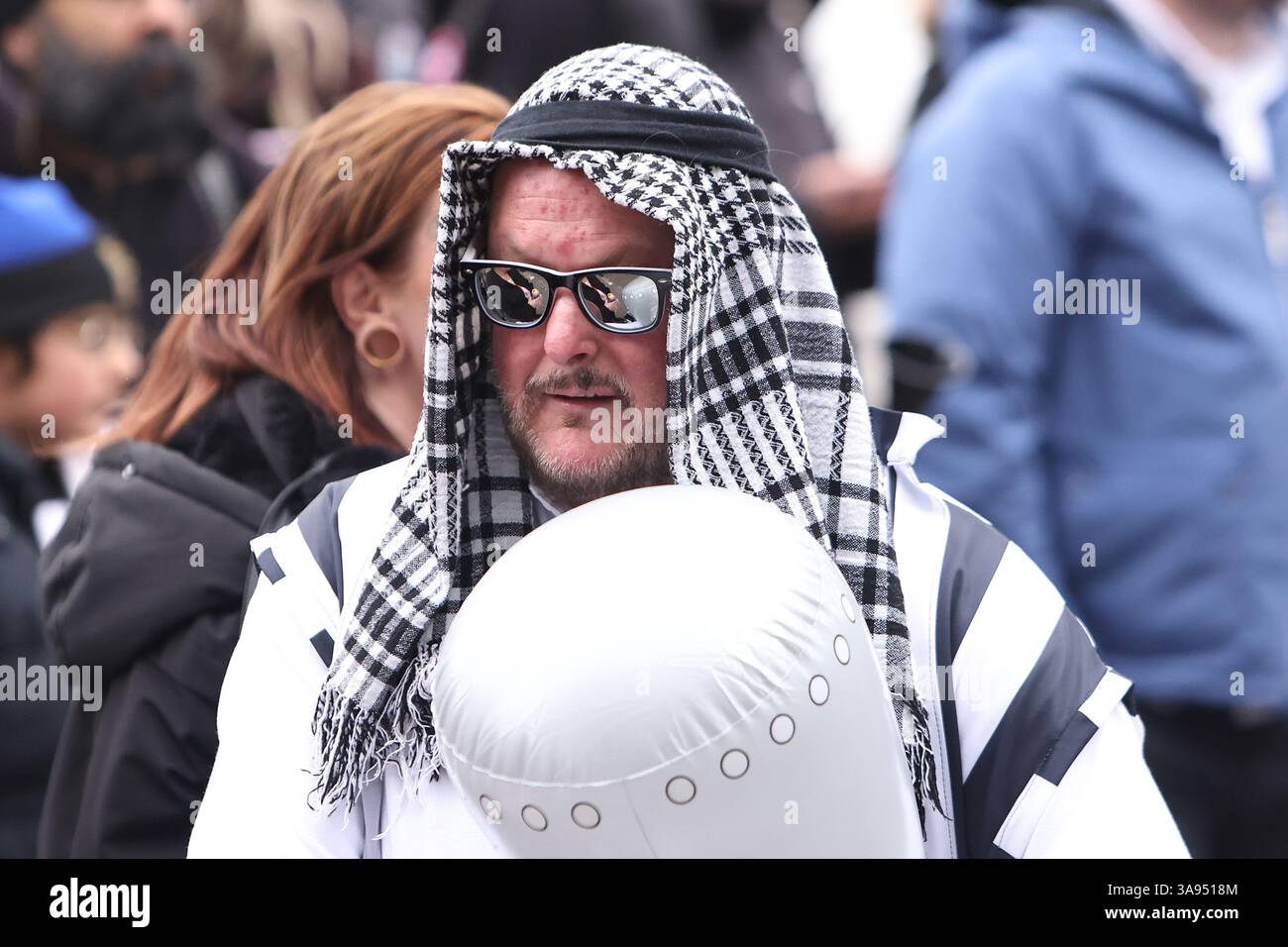 Newcastle, UK. 29th Mar 2025. A Newcastle United fan in a Saudi Arabian ...