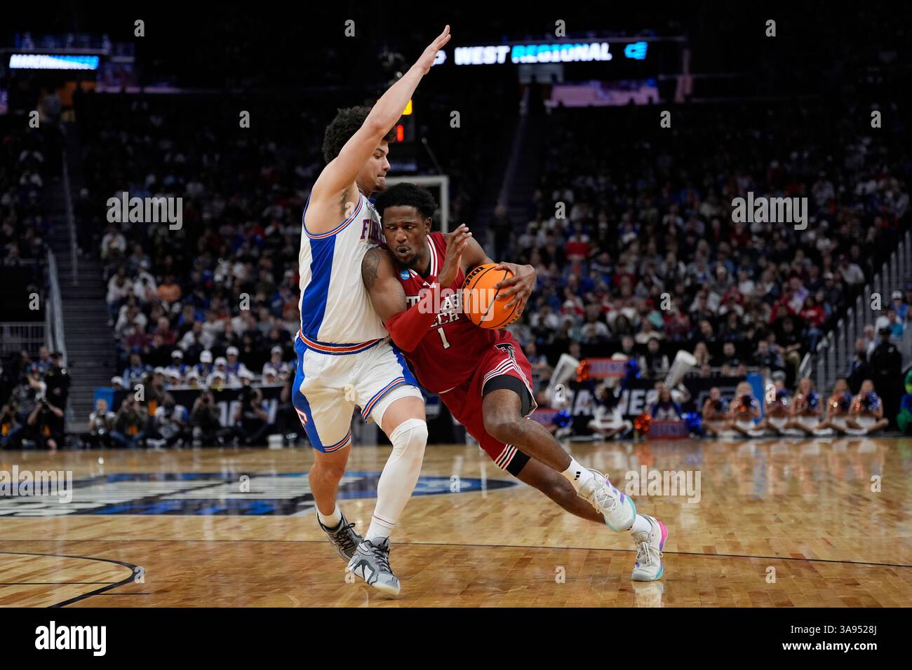 Texas Tech guard Kevin Overton (1) drives past Florida guard Walter ...