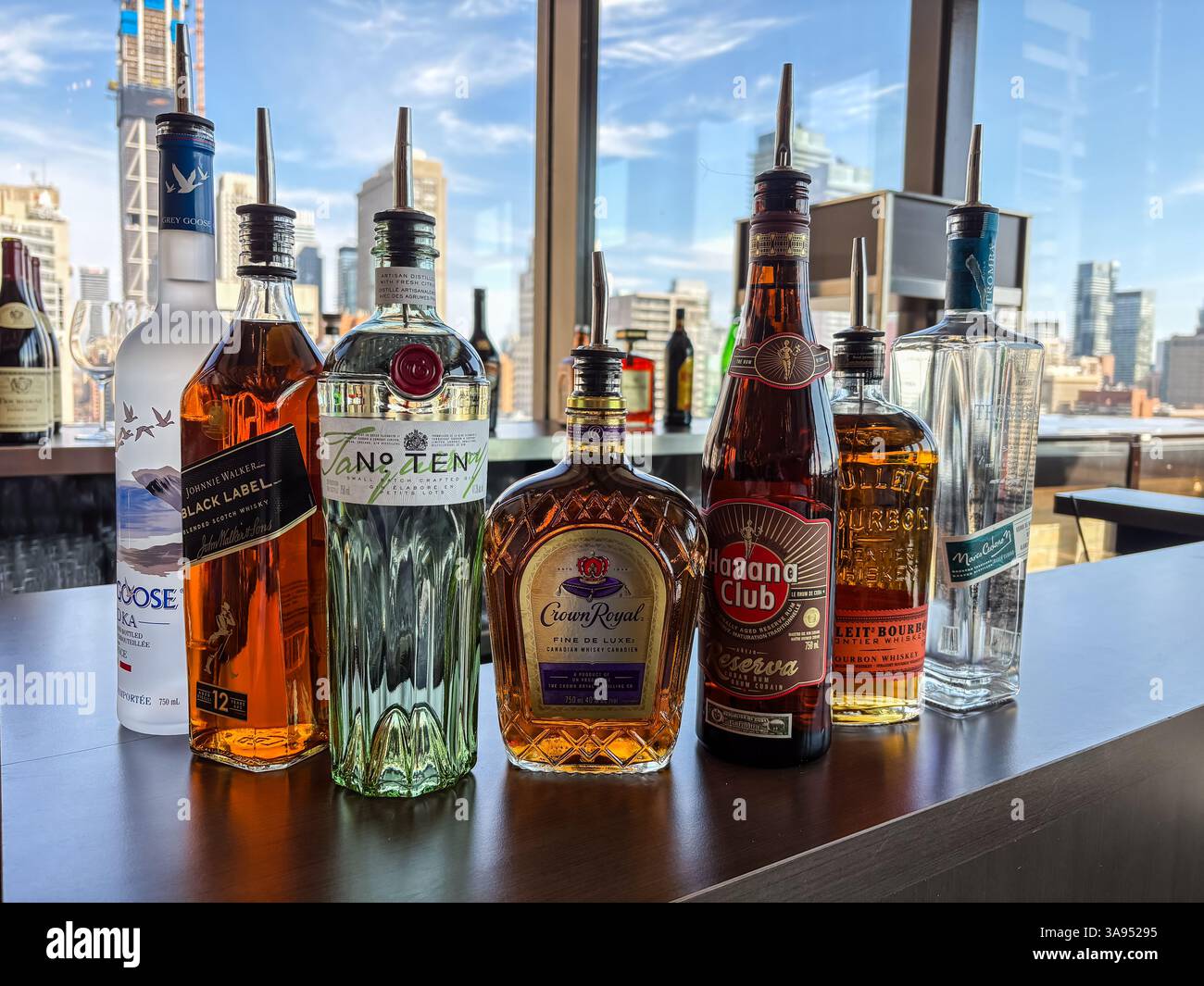 An assortment of different liquor bottles including whisky, vodka, gin ...