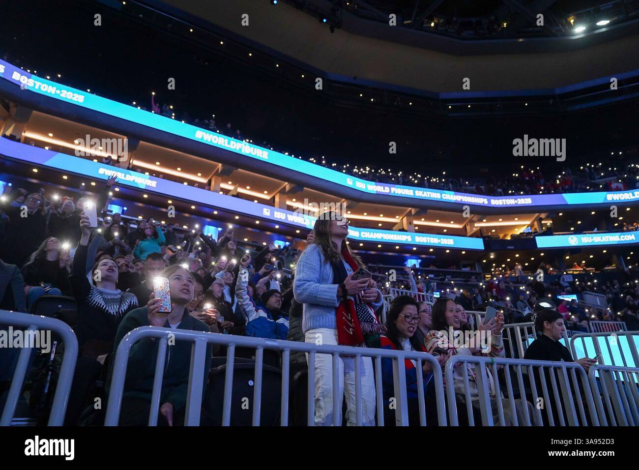 The crowd shines lights during the Men's Free Skate program during the ...