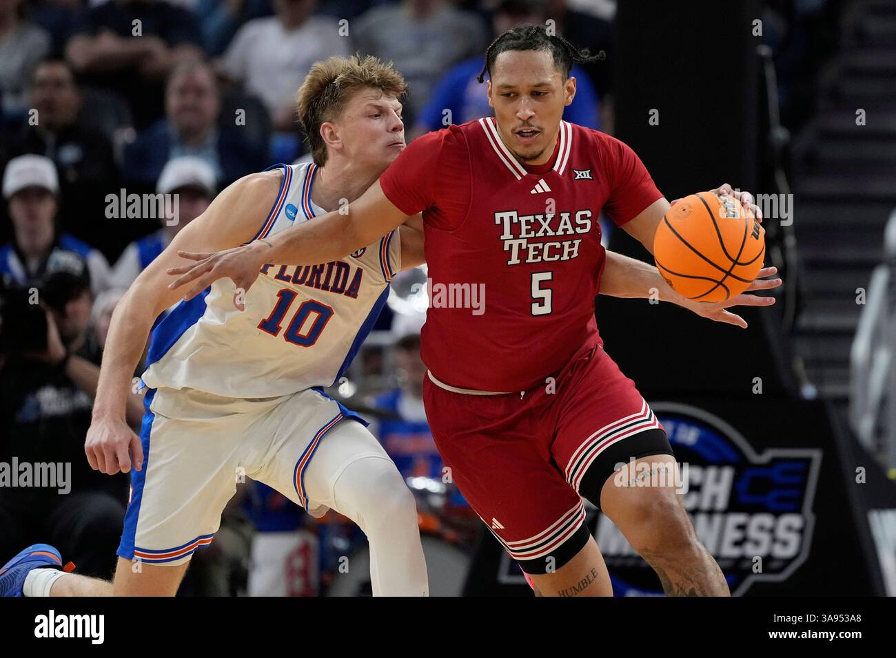 Texas Tech forward Darrion Williams (5) is fouled by Florida forward ...