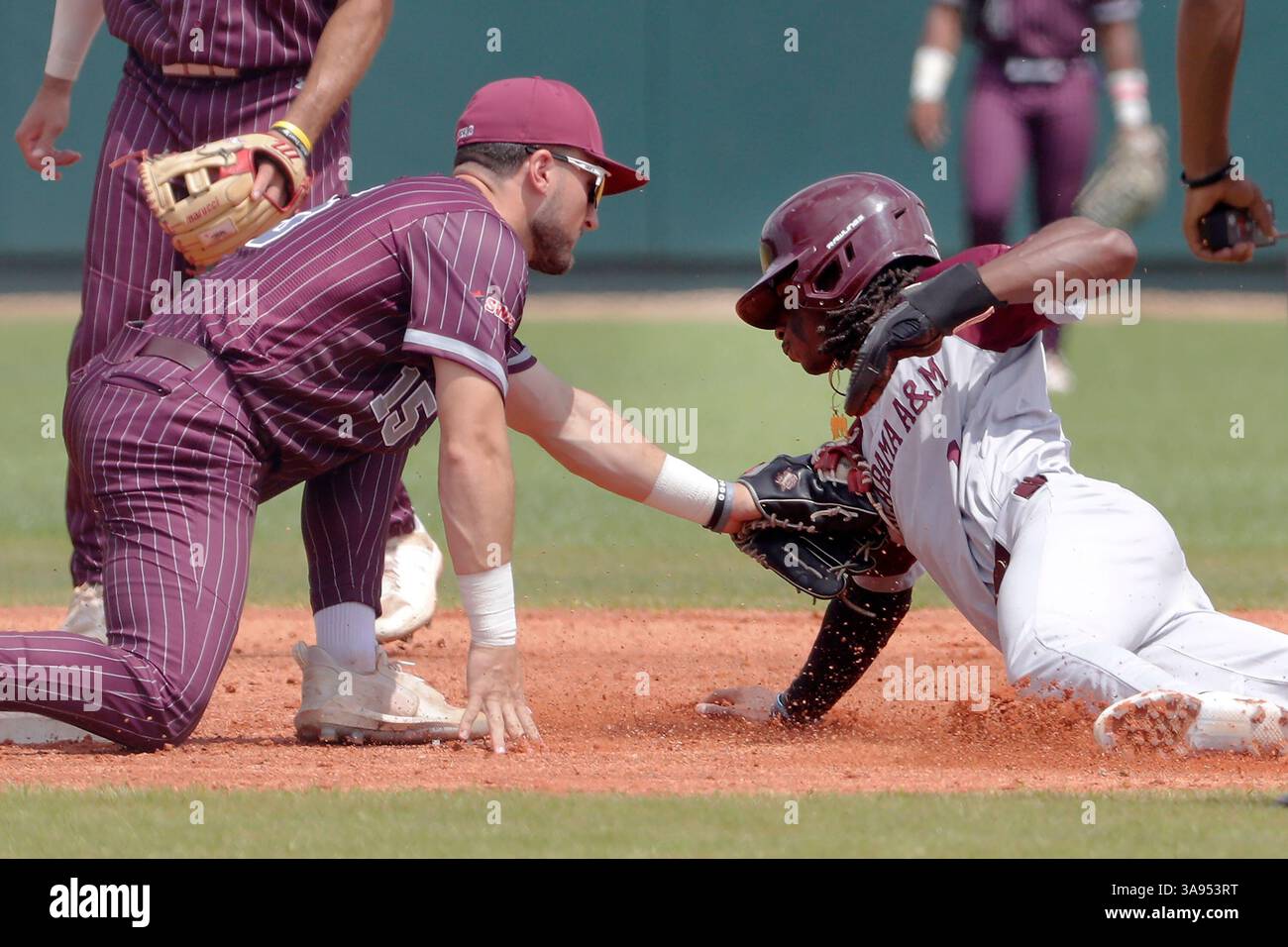 Texas Southern shortstop Bryce Hughes, left, makes the tag for the out ...