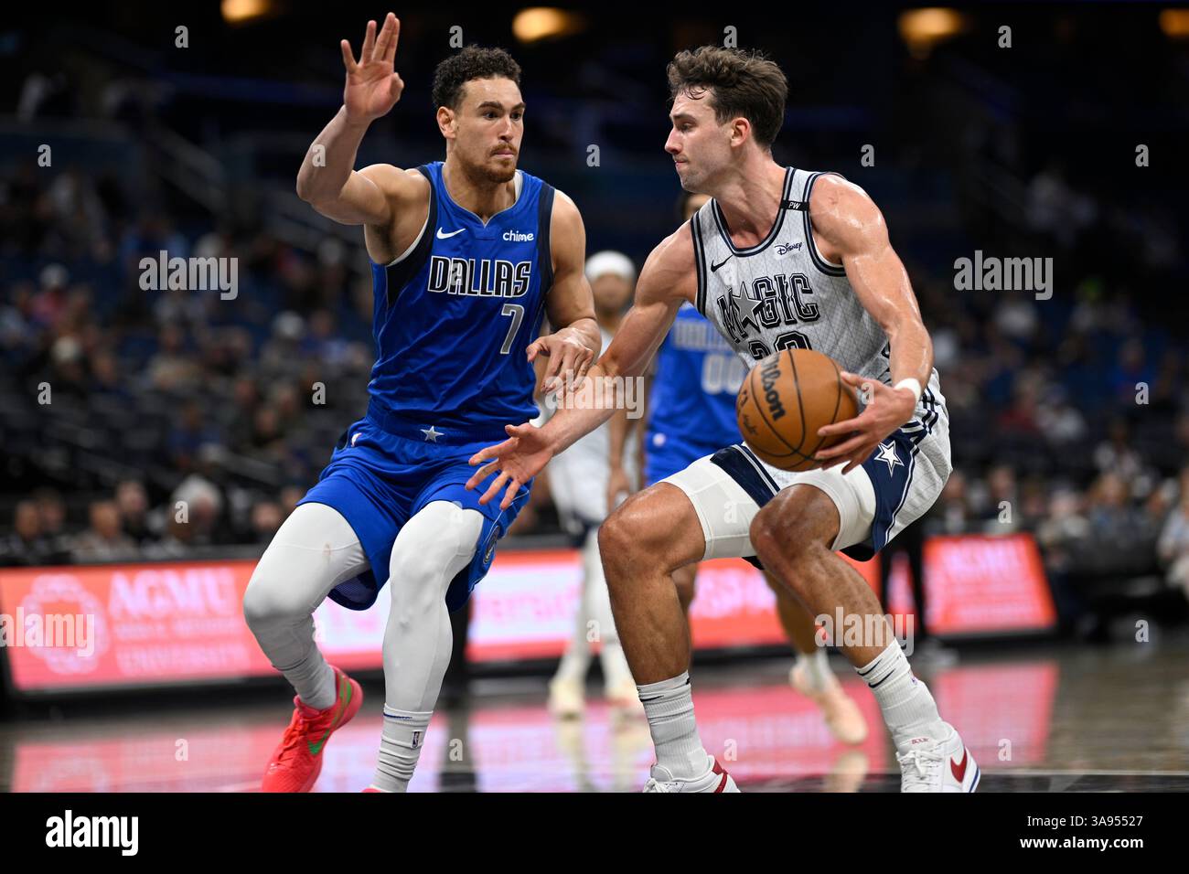 Orlando Magic forward Franz Wagner (22) is defended by Dallas Mavericks ...