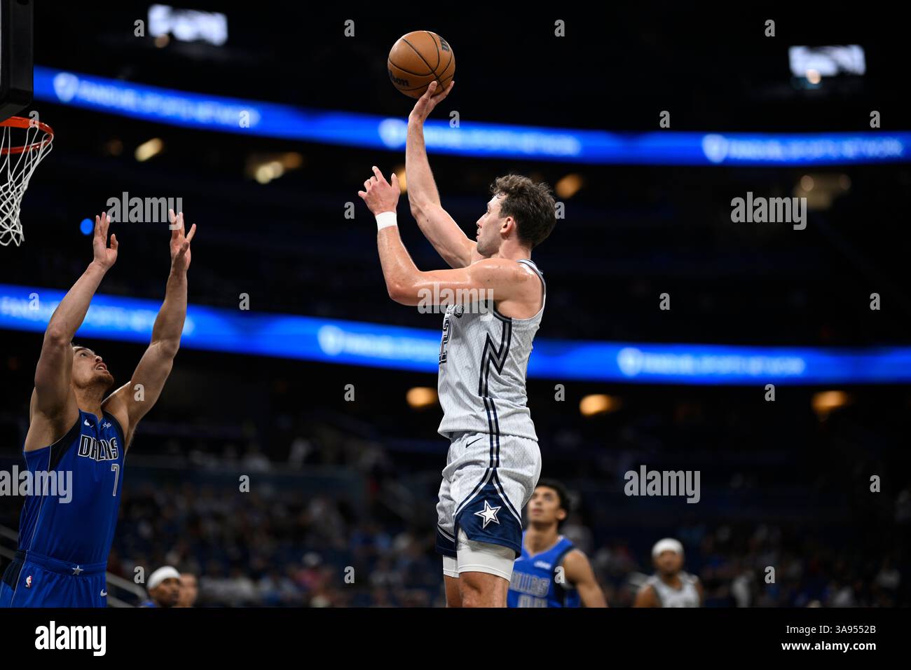 Orlando Magic forward Franz Wagner (22) goes up to shoot as Dallas Mavericks center Dwight ...
