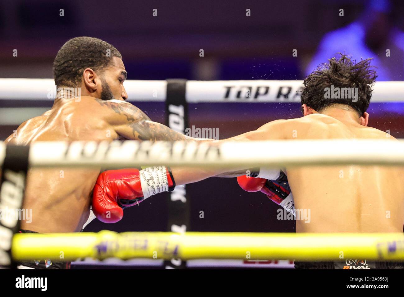 March 29, 2025: (L-R) Welterweight Tiger Johnson throws a punch at ...