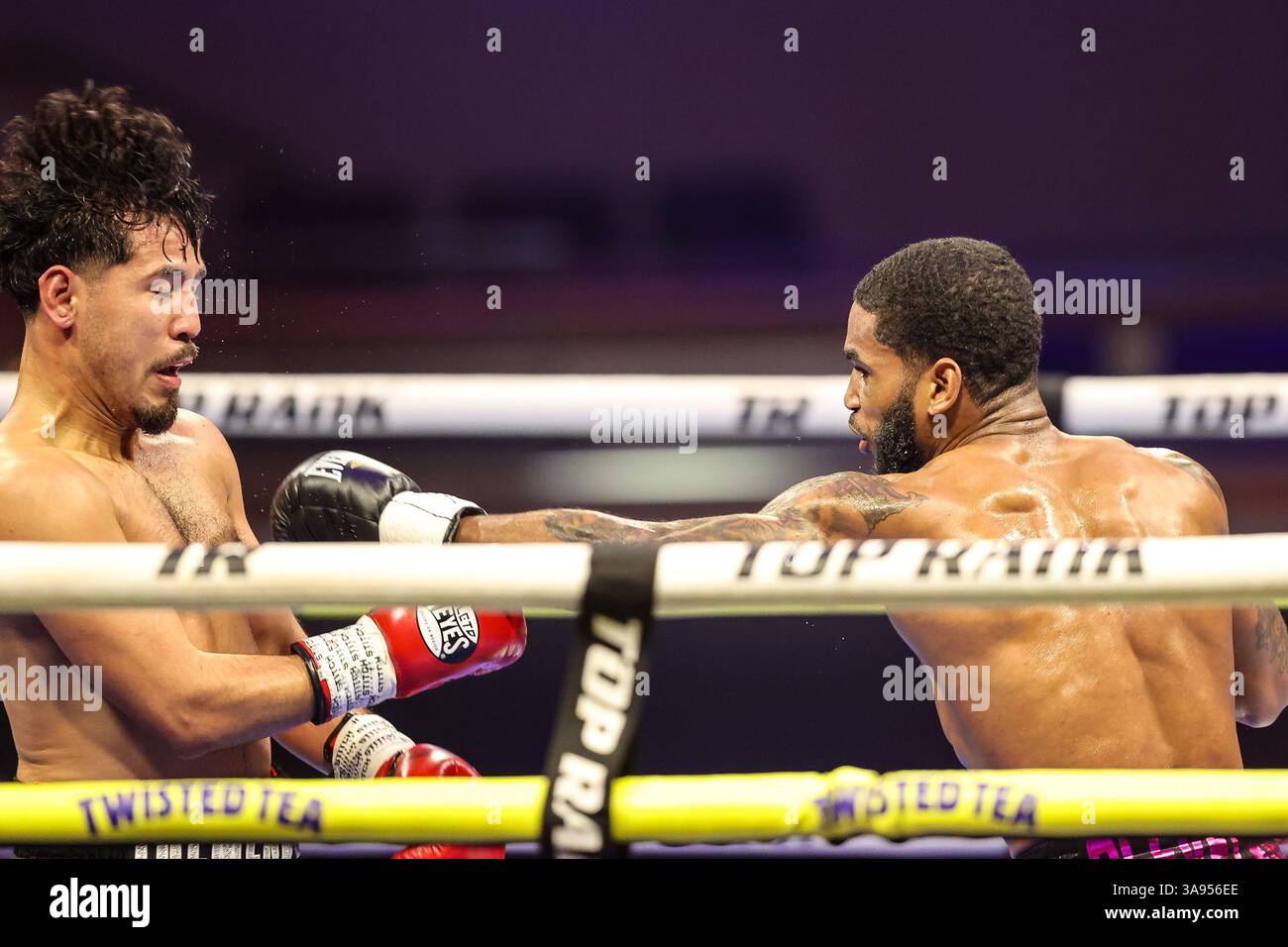 March 29, 2025: (R-L) Welterweight Tiger Johnson throws a punch at ...