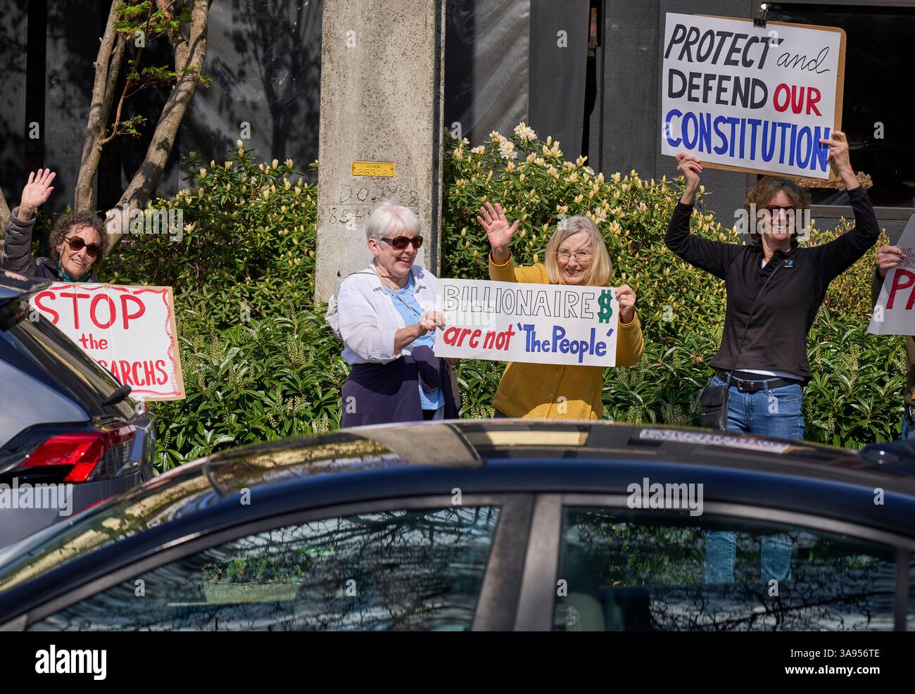Pro-democracy demonstrators call for a boycott of Tesla in Eugene ...