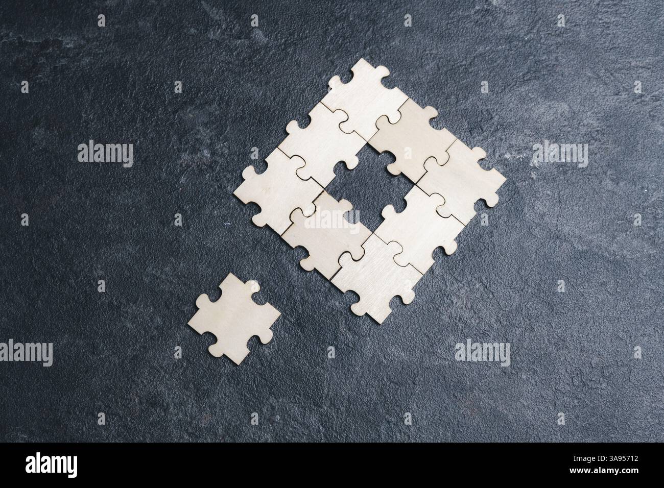 The key puzzle piece remains to be connected. Business concept. Dark ...