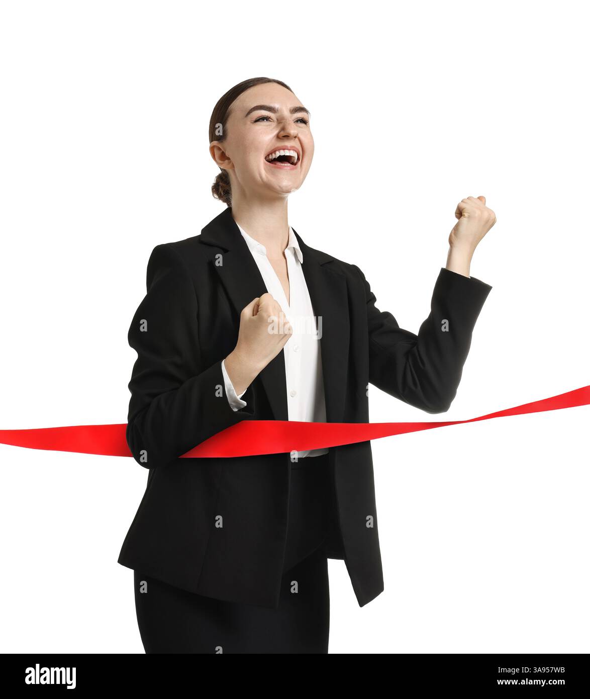 Happy businesswoman crossing red finish line ribbon on white background ...