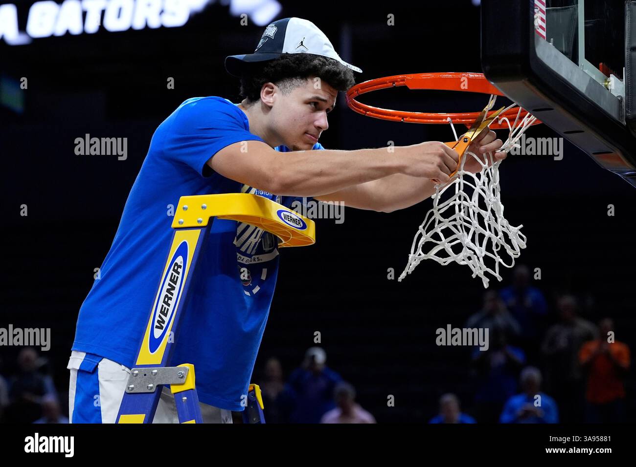 Florida guard Walter Clayton Jr. cuts down the net after defeating ...