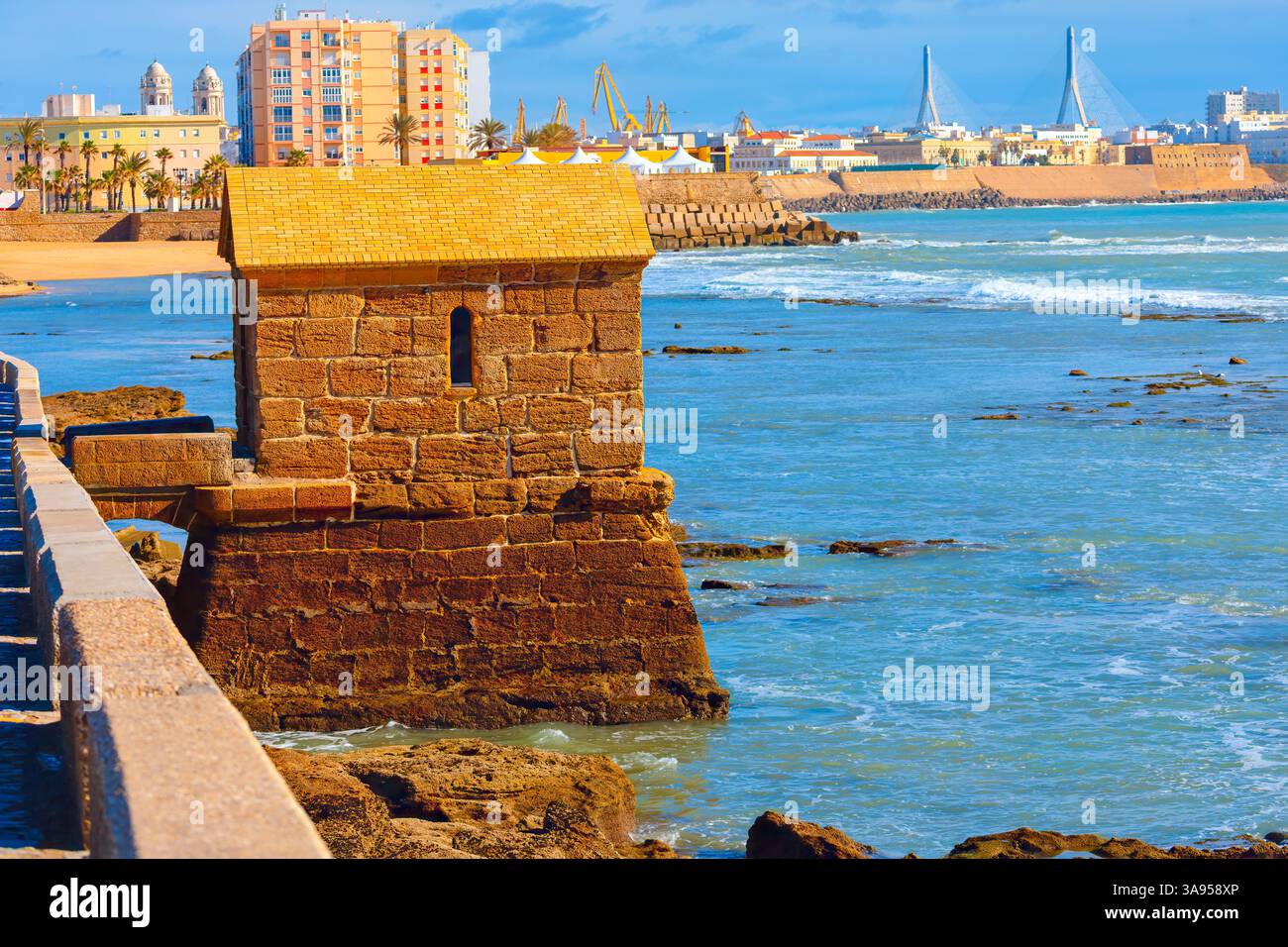 Historic fort stands at the edge of ocean in Cadiz, Spain, blending ...