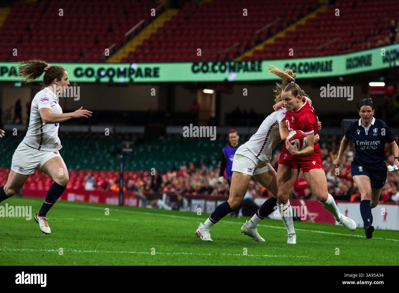 Cardiff, UK, 29th March 2025 Wales wing Carys Cox is tackled by player ...