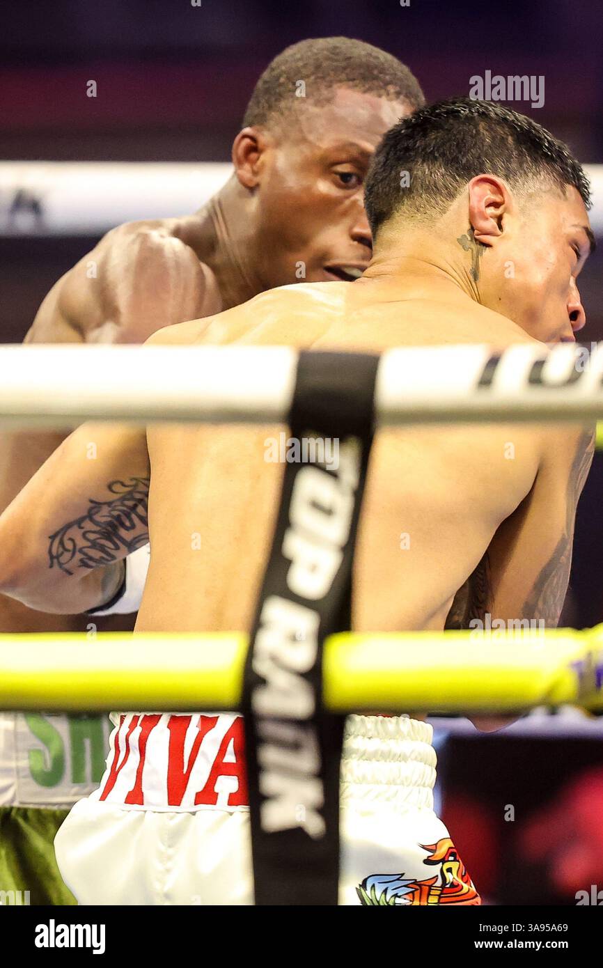 March 29, 2025: (L-R) Featherweight Bruce Carrington punches Jose Enrique Vivas during the Mayer ...