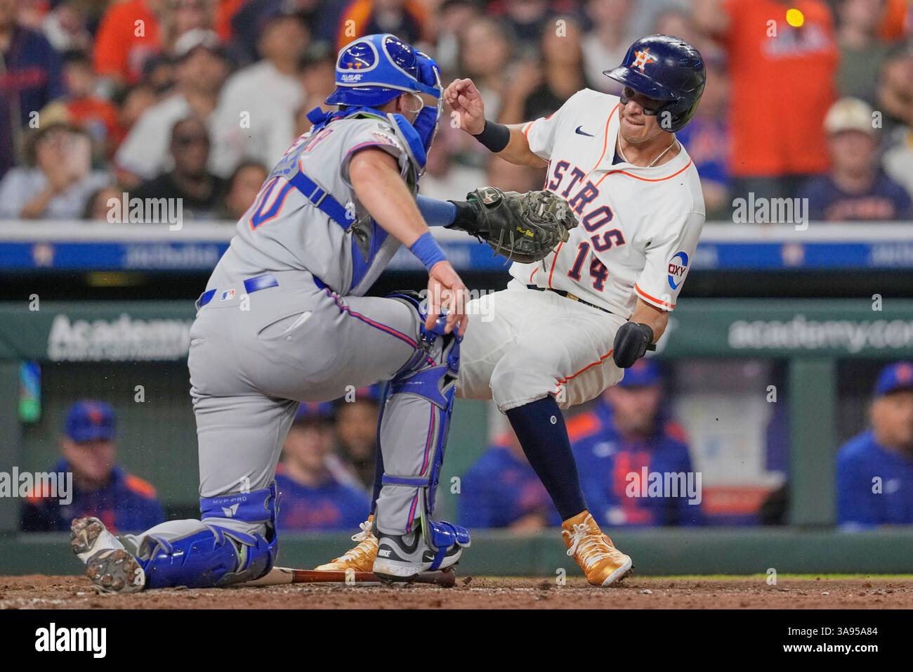 Houston Astros' Mauricio Dubón (14) is tagged out by New York Mets ...