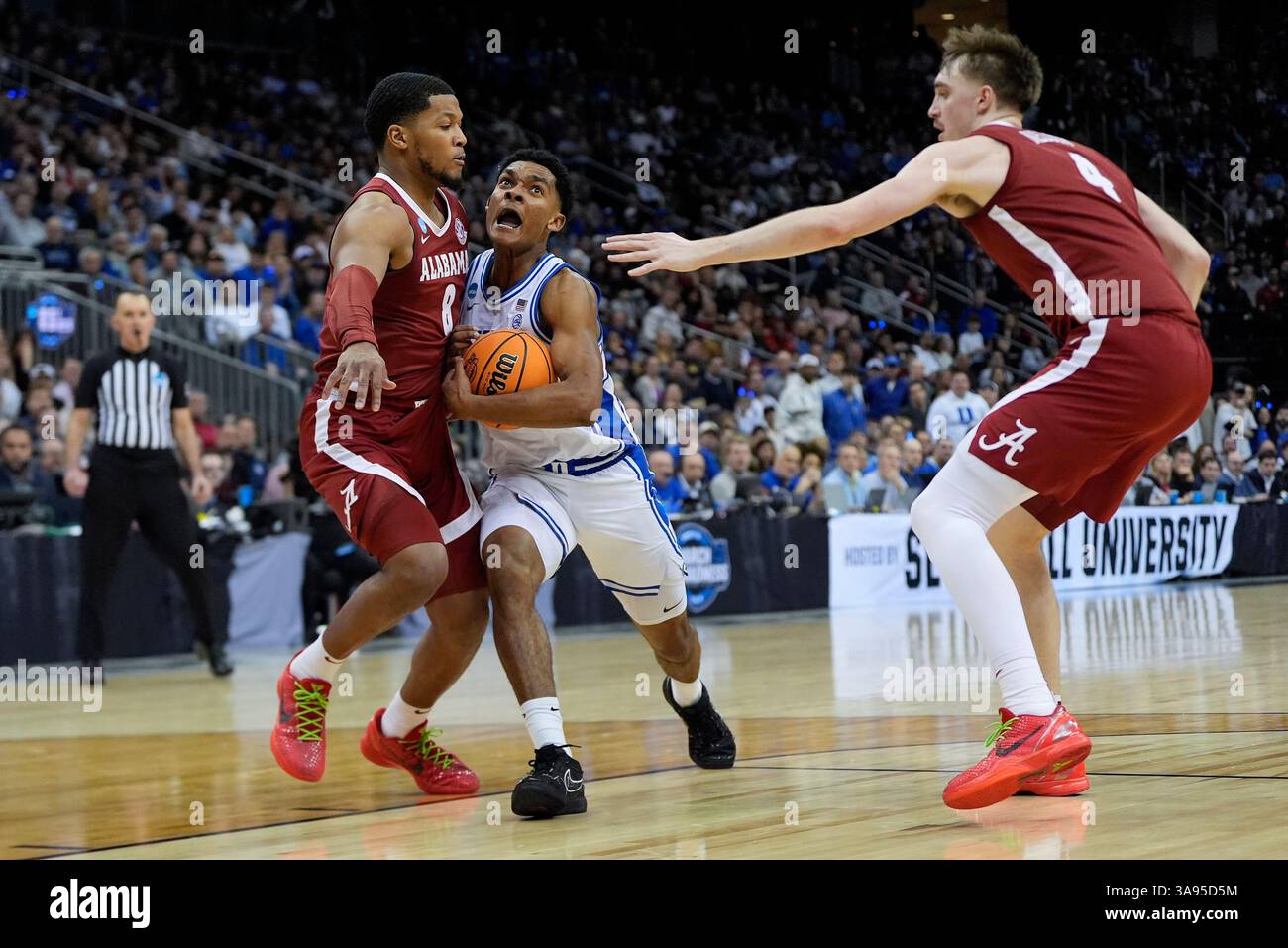 Duke guard Caleb Foster (1) drives against Alabama guard Chris ...