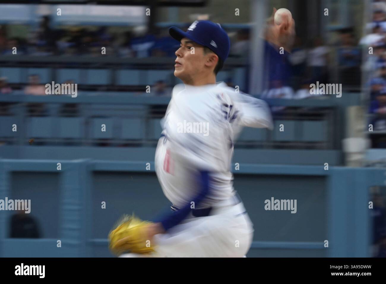 Los Angeles Dodgers pitcher Roki Sasaki throws to the plate during the ...
