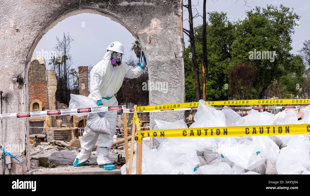 Altadena, California, USA. 29th Mar, 2025. Workers wearing hazmat suits ...