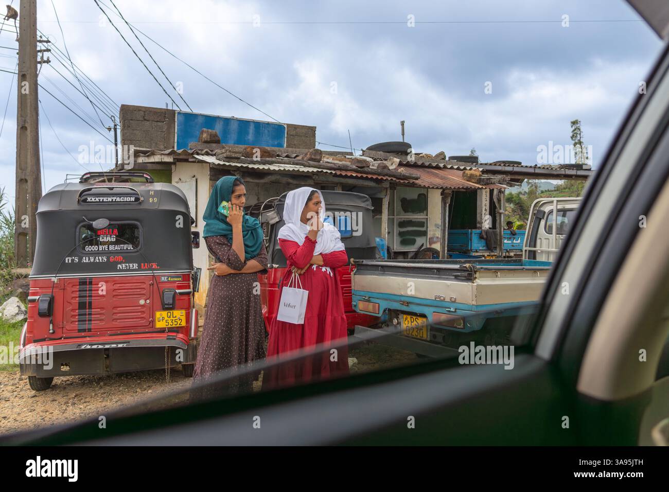 Welimada Sri Lanka - September 7 2024; Two Islamic women in hijab and bright clothes through car ...