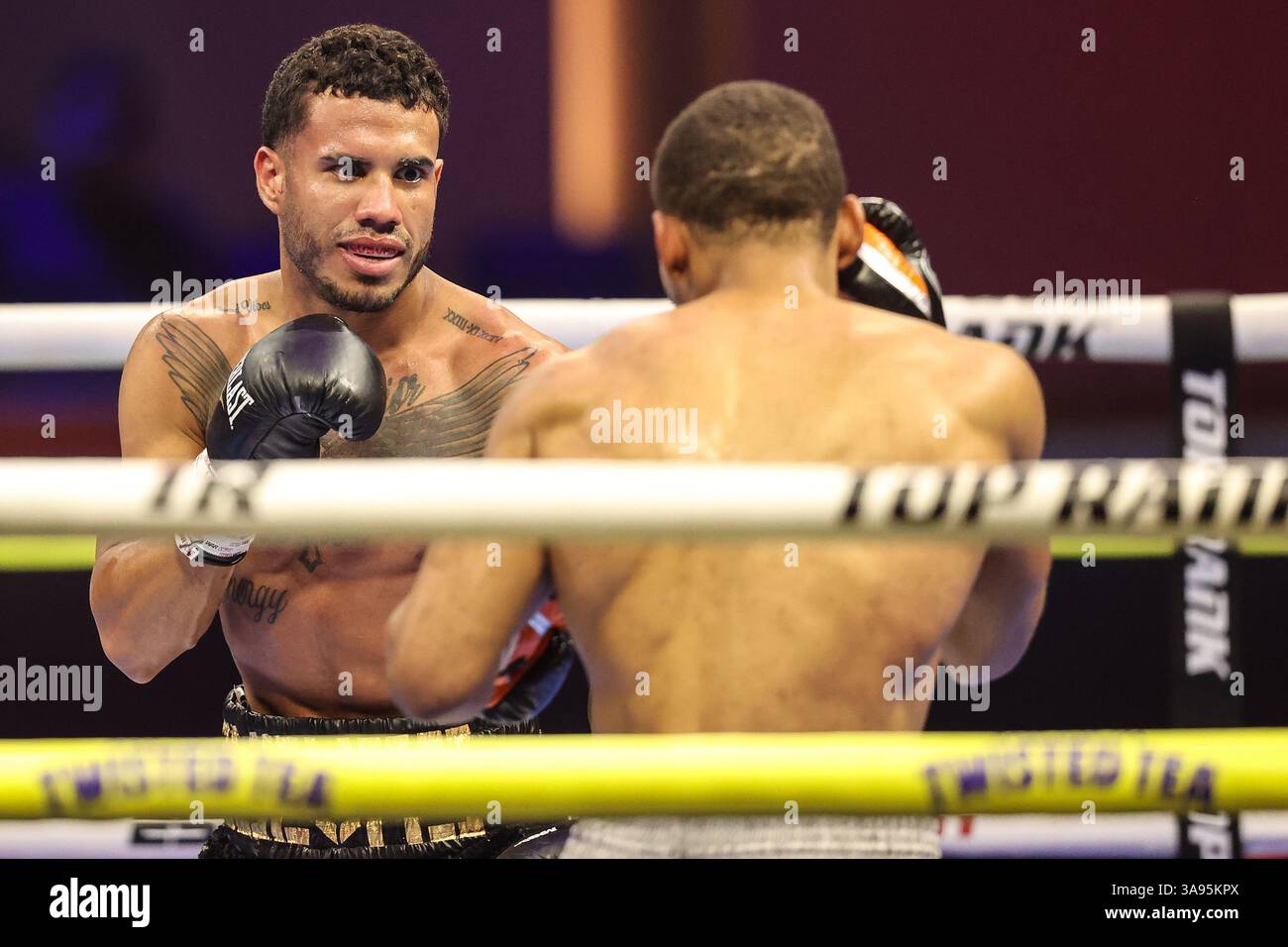 March 29, 2025: (R-L) Welterweight Derrieck Cuevas watches Brian Norman ...