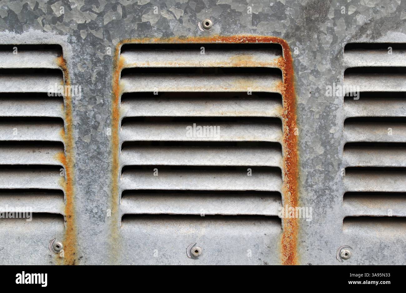 Rusty air vents on a steel textured background Stock Photo - Alamy