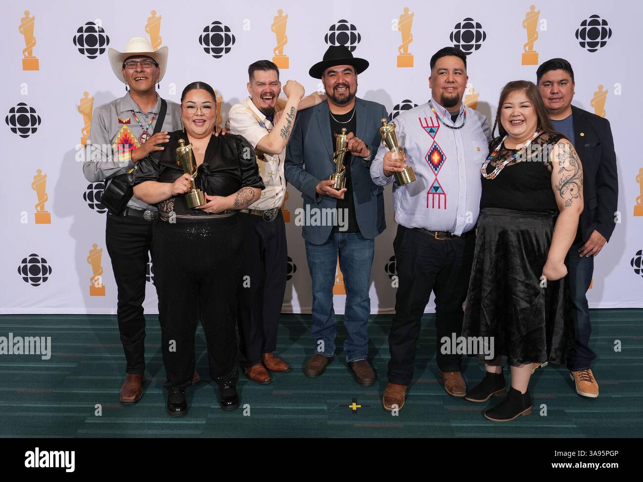 The Black Bear Singers pose for photos after winning Traditional ...