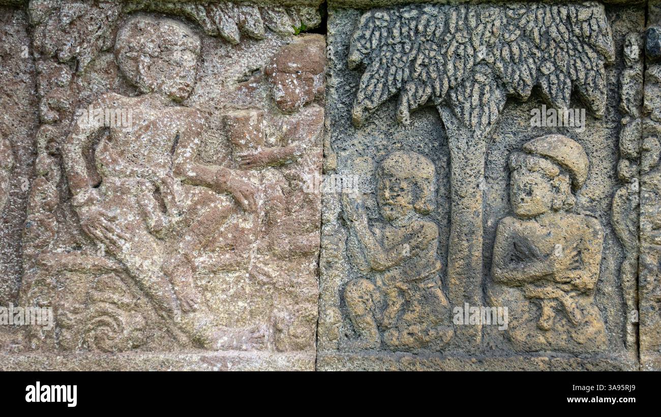 Carvings on the stone walls of Penataran temple. Penataran temple is ...