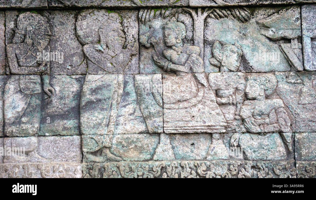 Carvings on the stone walls of Penataran temple. Penataran temple is ...